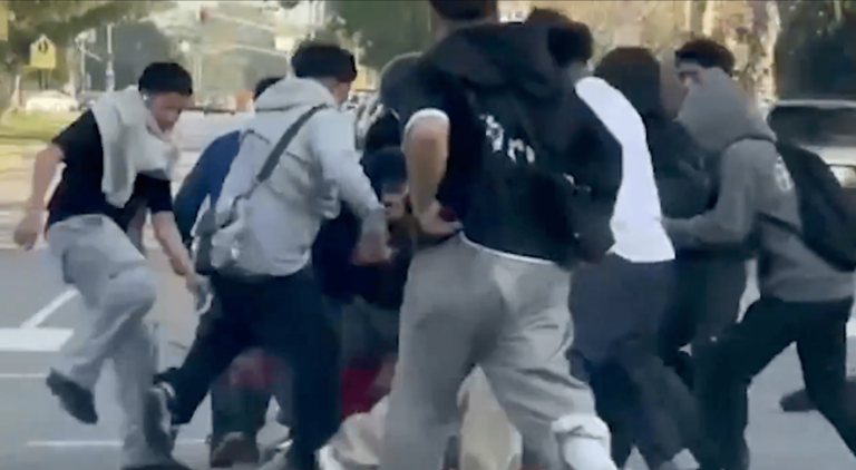 LAPD arrests 2 in video of teens on bikes beating man in Mid-Wilshire