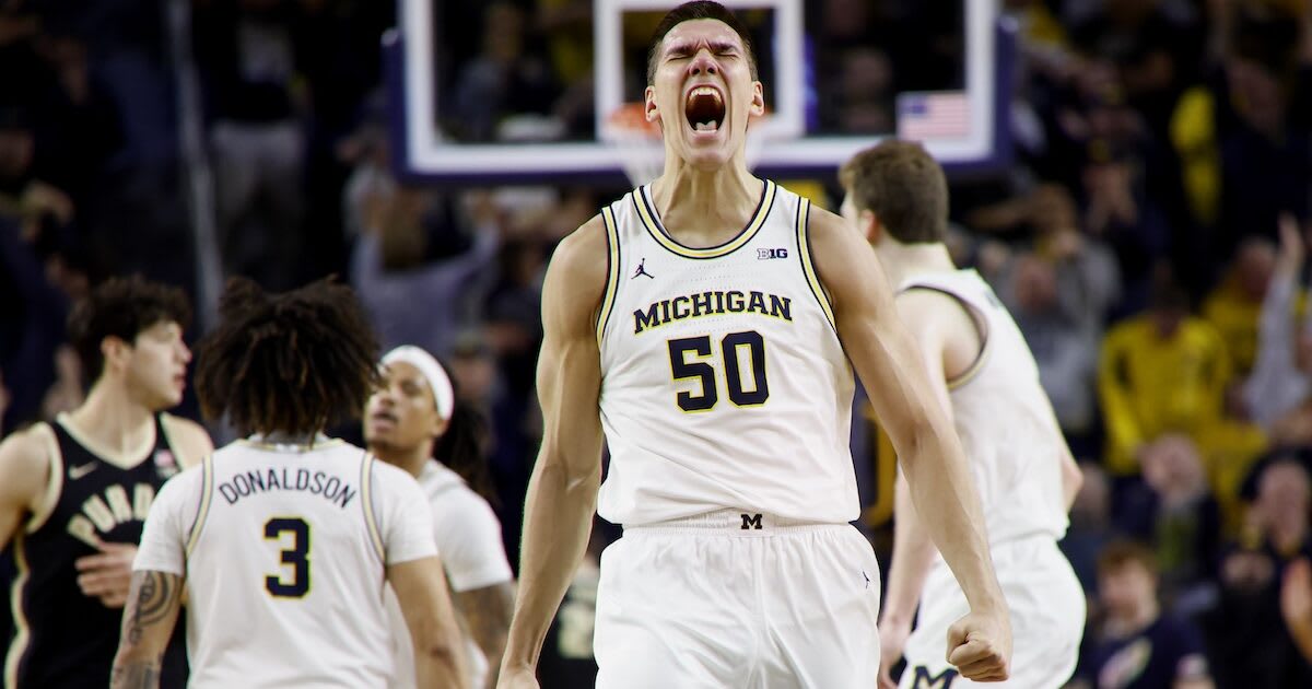 Michigan star Vlad Goldin reunites with parents for first time in five ...