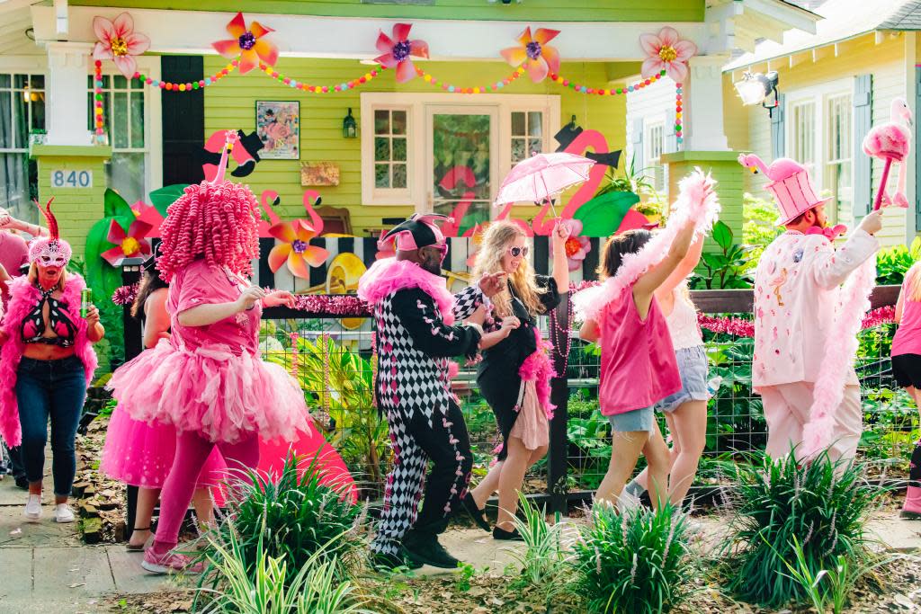 A parade of pink clothes and flamingos. Spanish Town Mardi Gras in ...