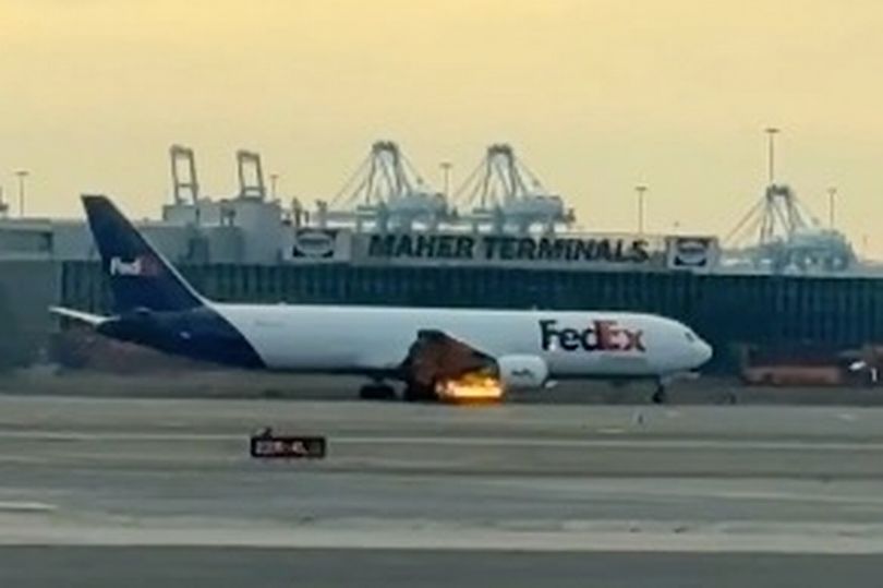 Terrifying moment flames roar from FedEx plane engine taking off at Newark