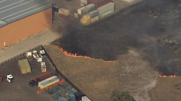 Out-of-control fire threatens lives, homes