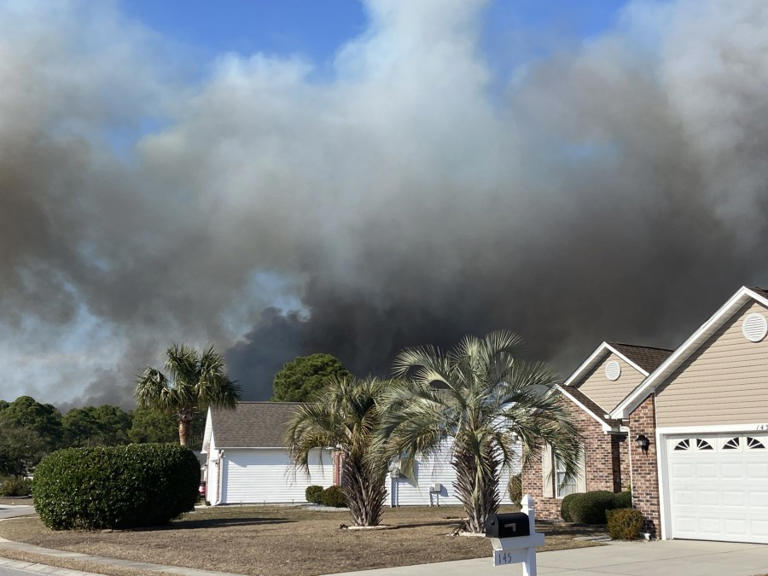 ‘I’m very scared’: Massive wildfire threatens dozens of Carolina Forest homes as neighborhoods ...
