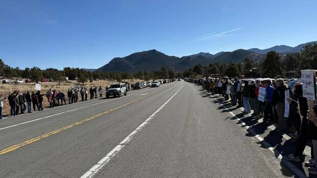Protesters gather at Colorado's Rocky Mountain National Park as part of ...