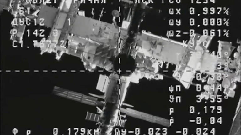 Russian cargo ship docks at space station with science, spacesuit and supplies
