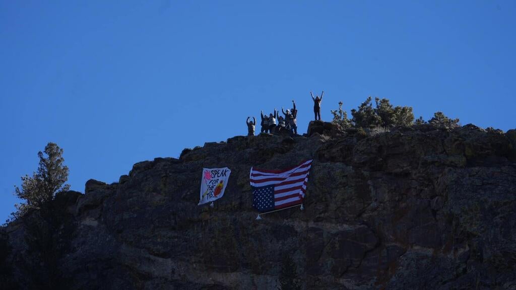 Protesters gather at Colorado's Rocky Mountain National Park as part of ...