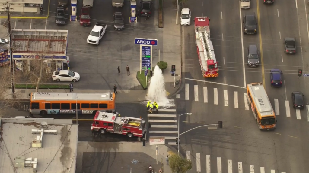 Metro bus shears fire hydrant in West Adams