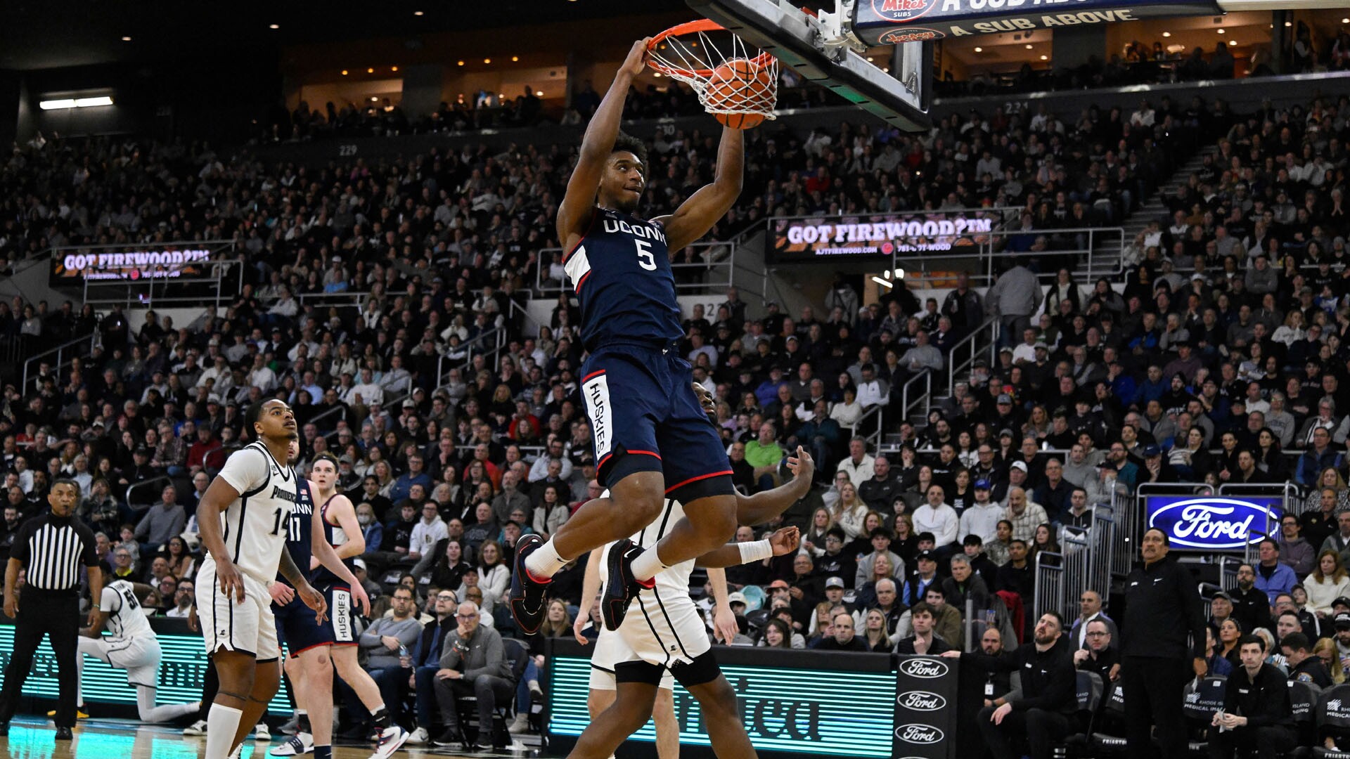 Reed scores 24 off the bench, UConn knocks off Providence 75-63