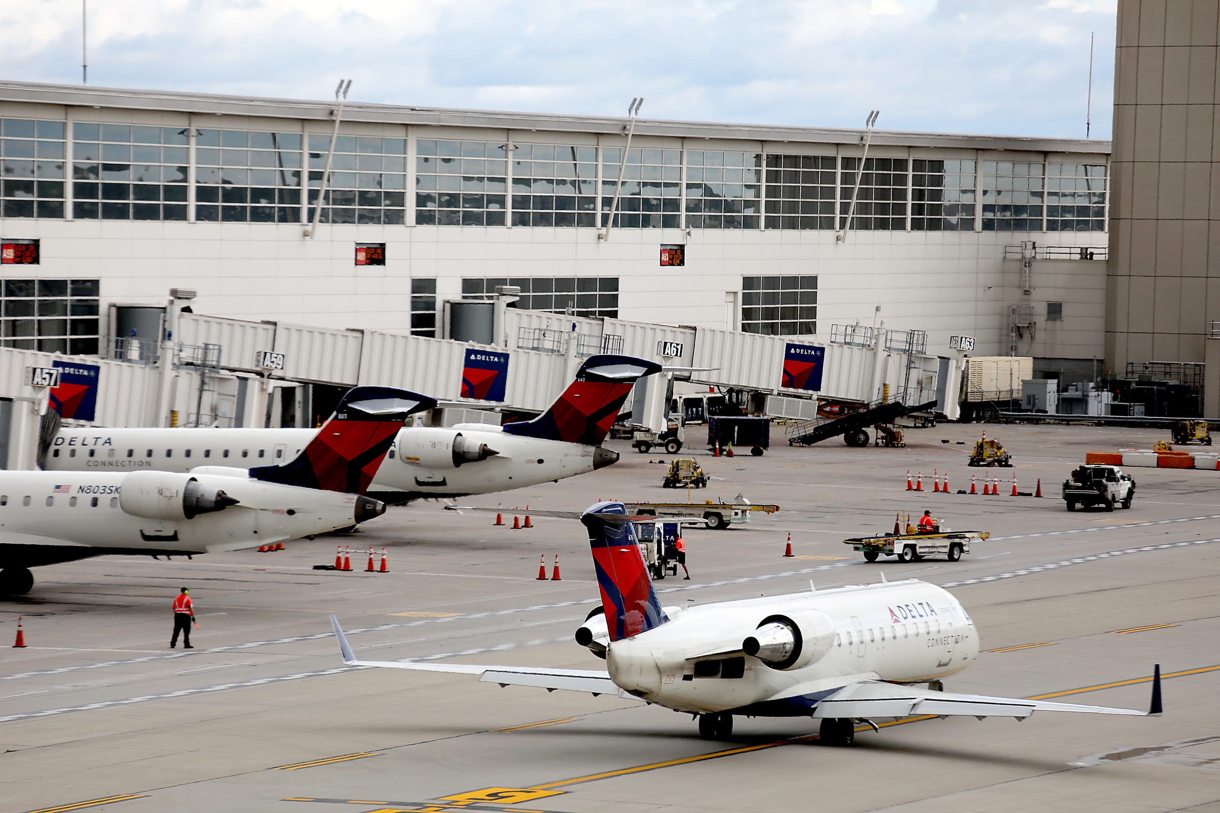Investigation underway after Delta employee struck by catering truck on ...