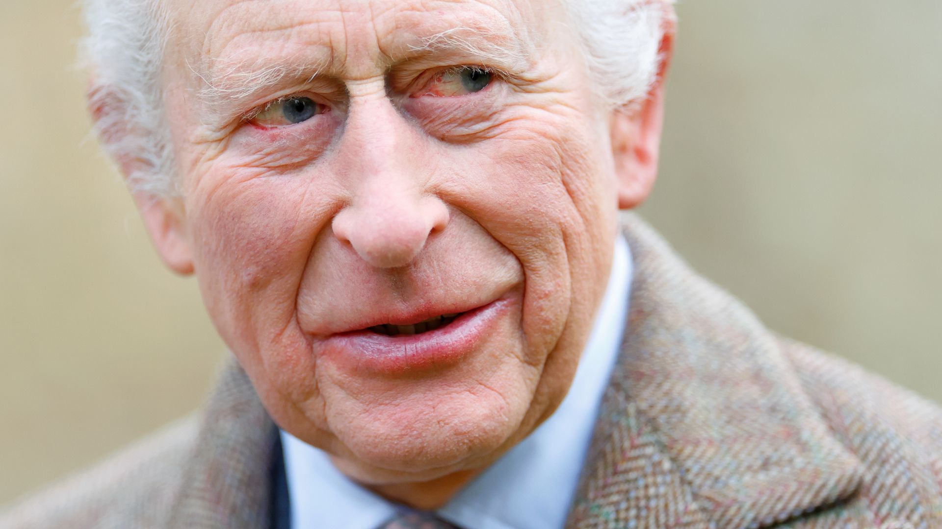 King Charles pictured with walking stick in new photos at home