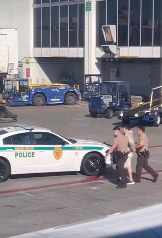 Couple arrested for allegedly forcing way past airport security — and ...