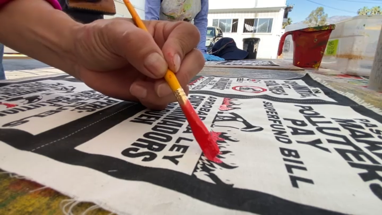 Artists use ash collected from LA wildfires to paint murals in Pasadena