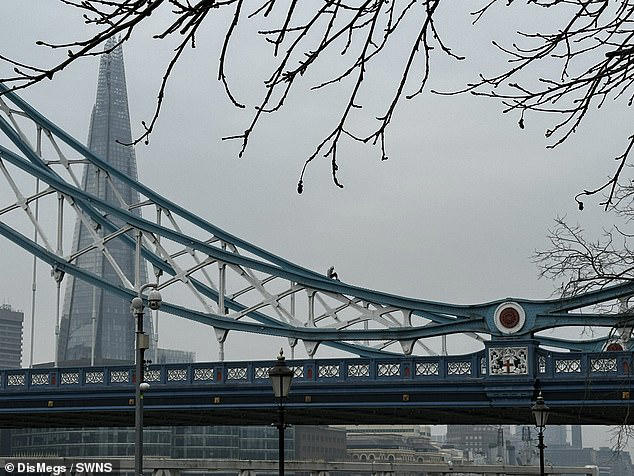 Tower Bridge closed as man climbs up landmark to perch on railings