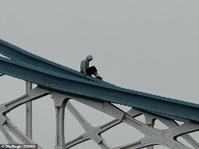 Tower Bridge closed as man climbs up landmark to perch on railings