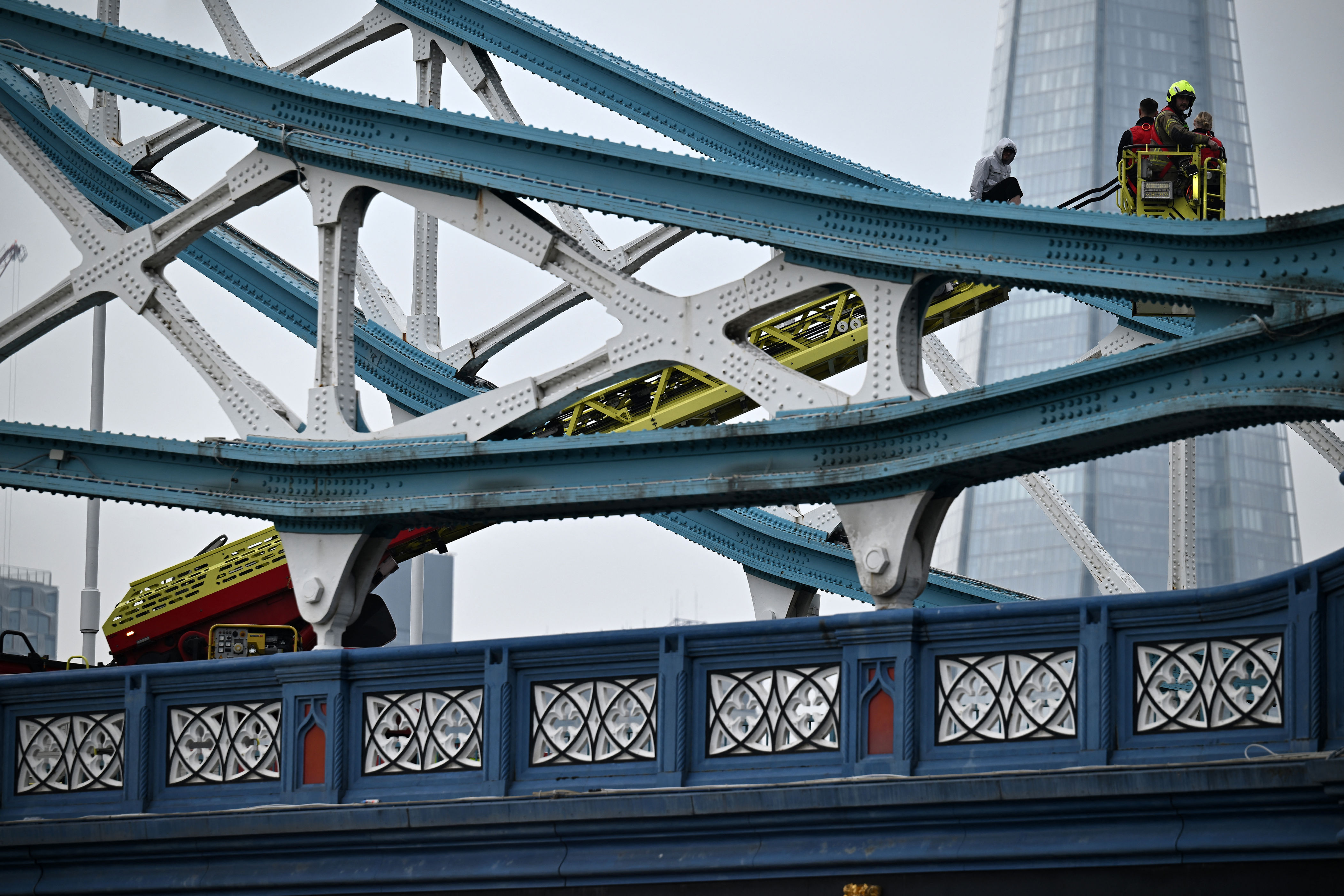 Photos show rescue mission underway after man scales Tower Bridge
