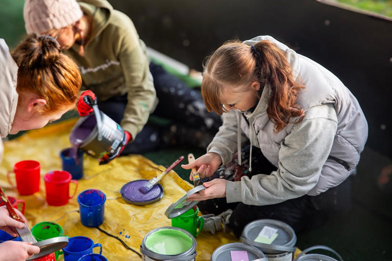 Painting & Decorating students tackle striking football mural
