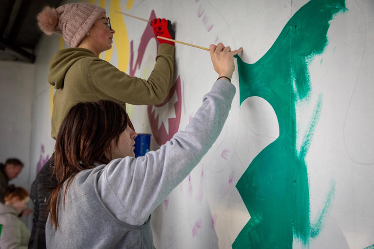 Painting & Decorating students tackle striking football mural