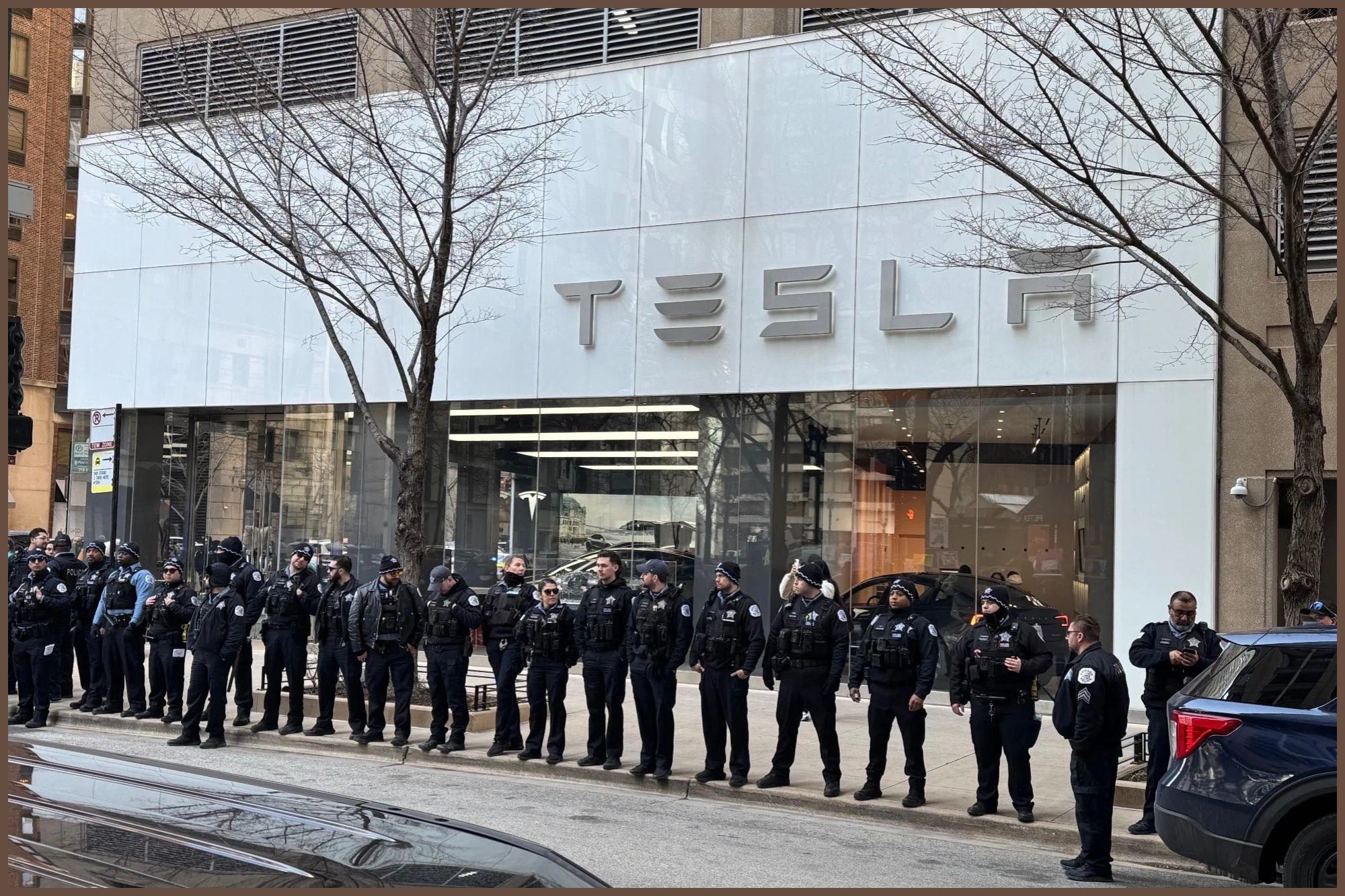 Chicago Police Criticized for Shielding Tesla Dealership During Women's ...