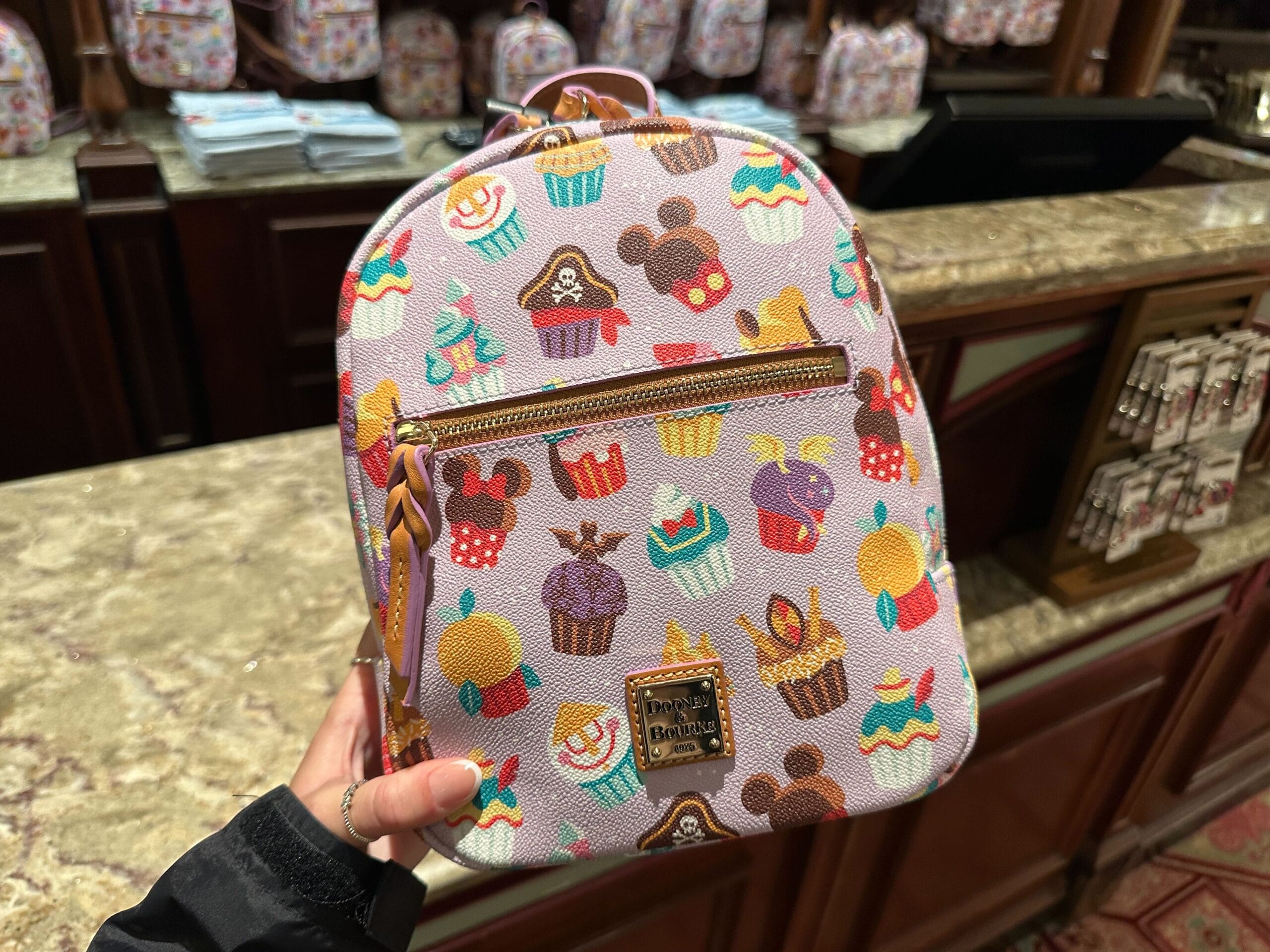 New Disney Treats-Themed Dooney & Bourke Backpack Arrives at Walt ...