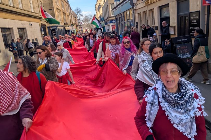 Massive red banner sweeps through Bath as protesters draw their own red ...