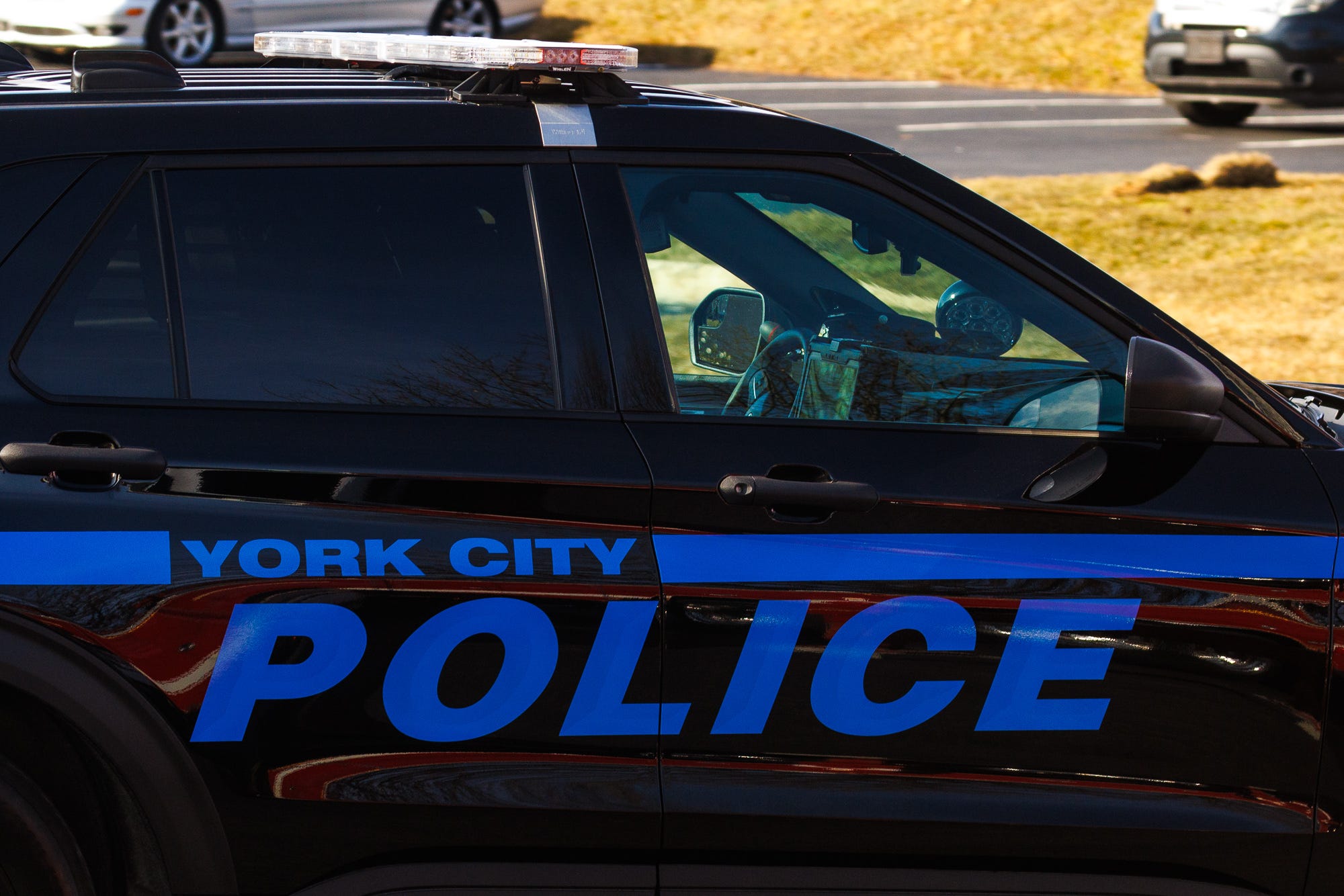 York woman charged after found unconscious with kids in parking garage