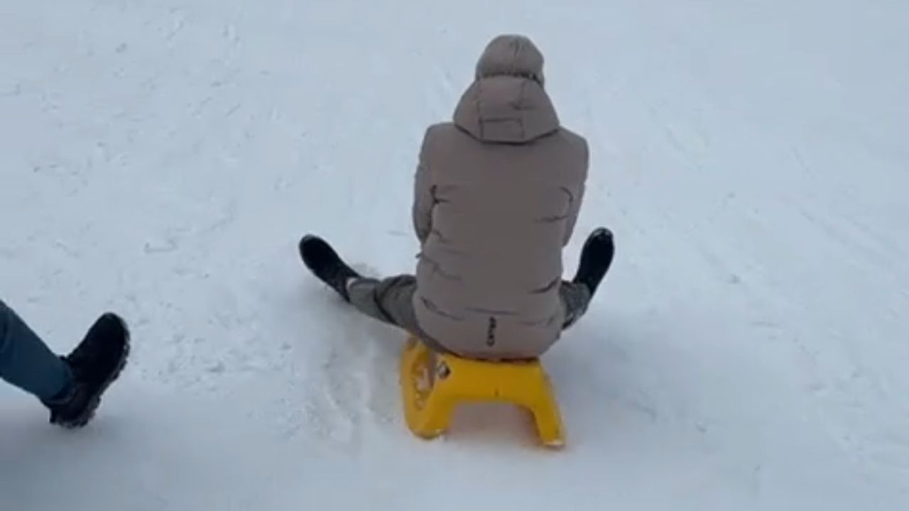 Sledding session takes a funny turn when two sleds crash into each other