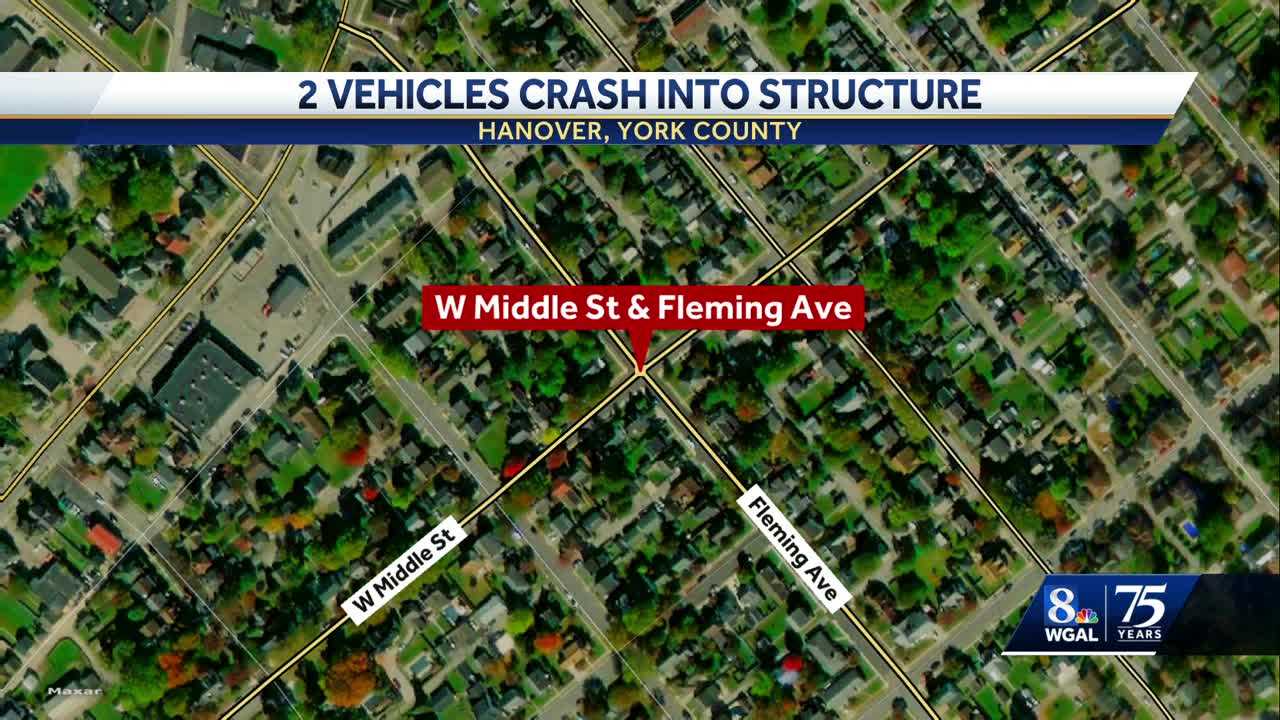 2 vehicles collide, crash into structure
