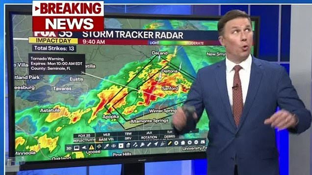 Tornado hits TV station while weather presenter is live