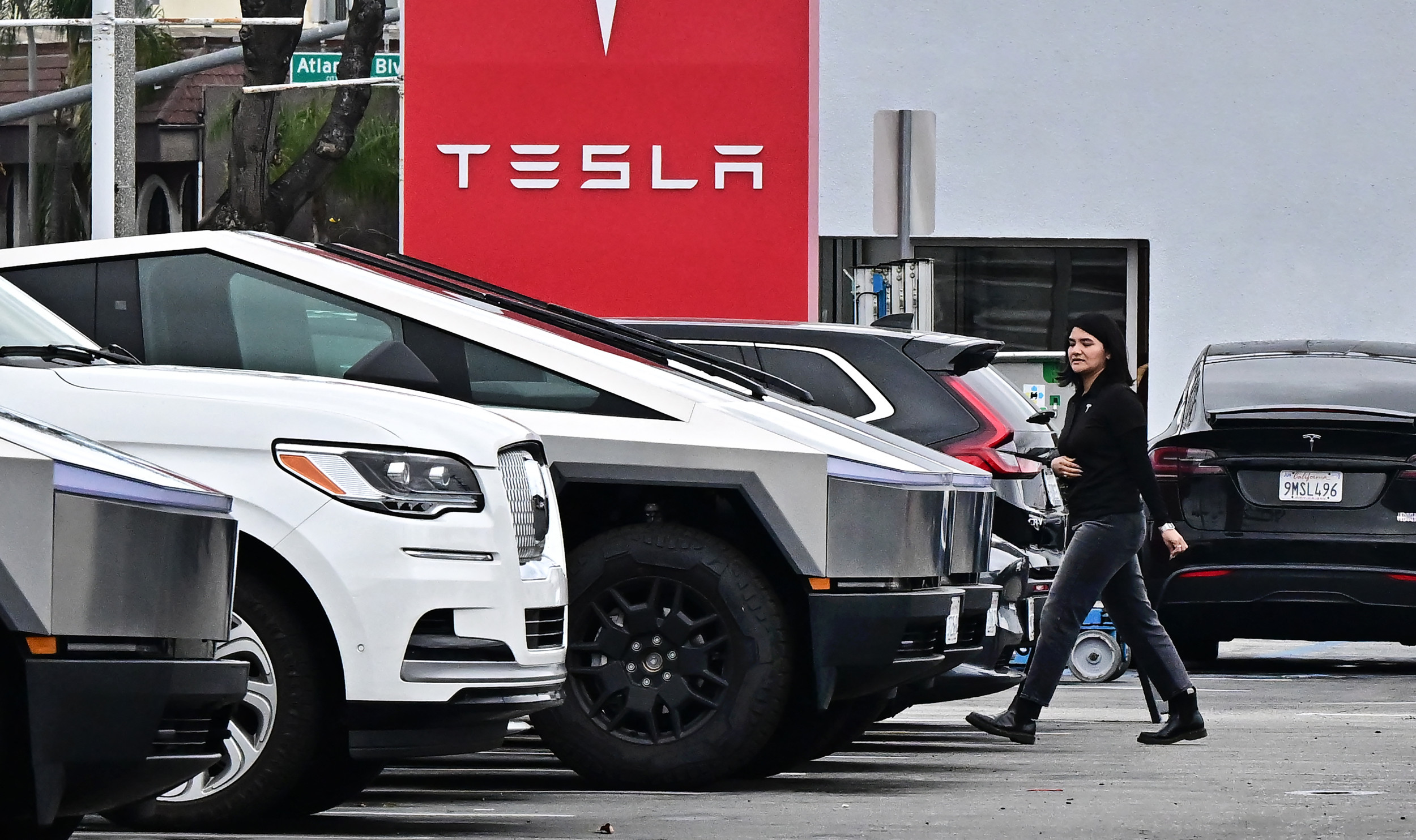 Elon Musk Protesters Want to 'Buy' a Tesla. Here's Why