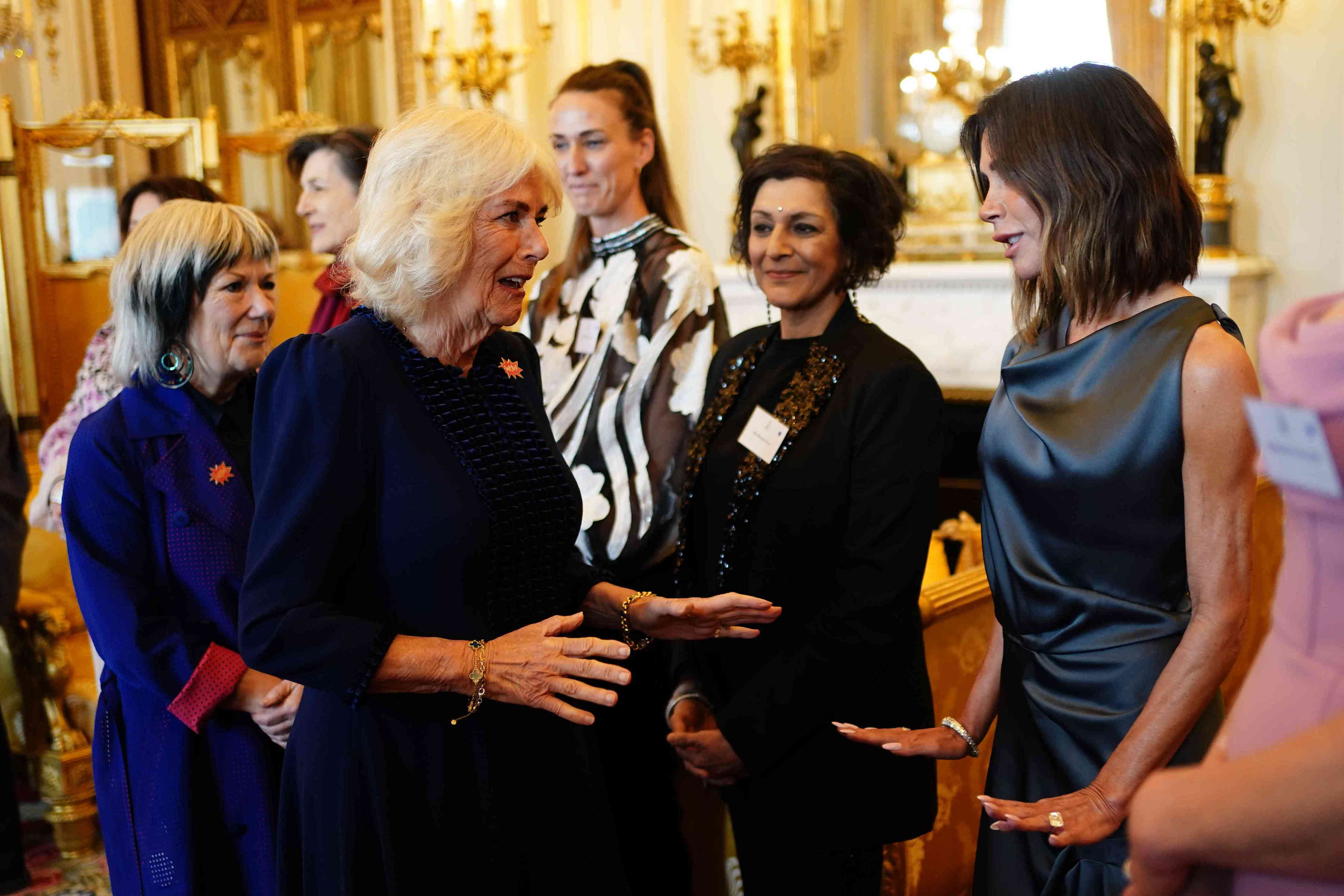 Here’s What Victoria Beckham Told Queen Camilla After Dropping Into an ...