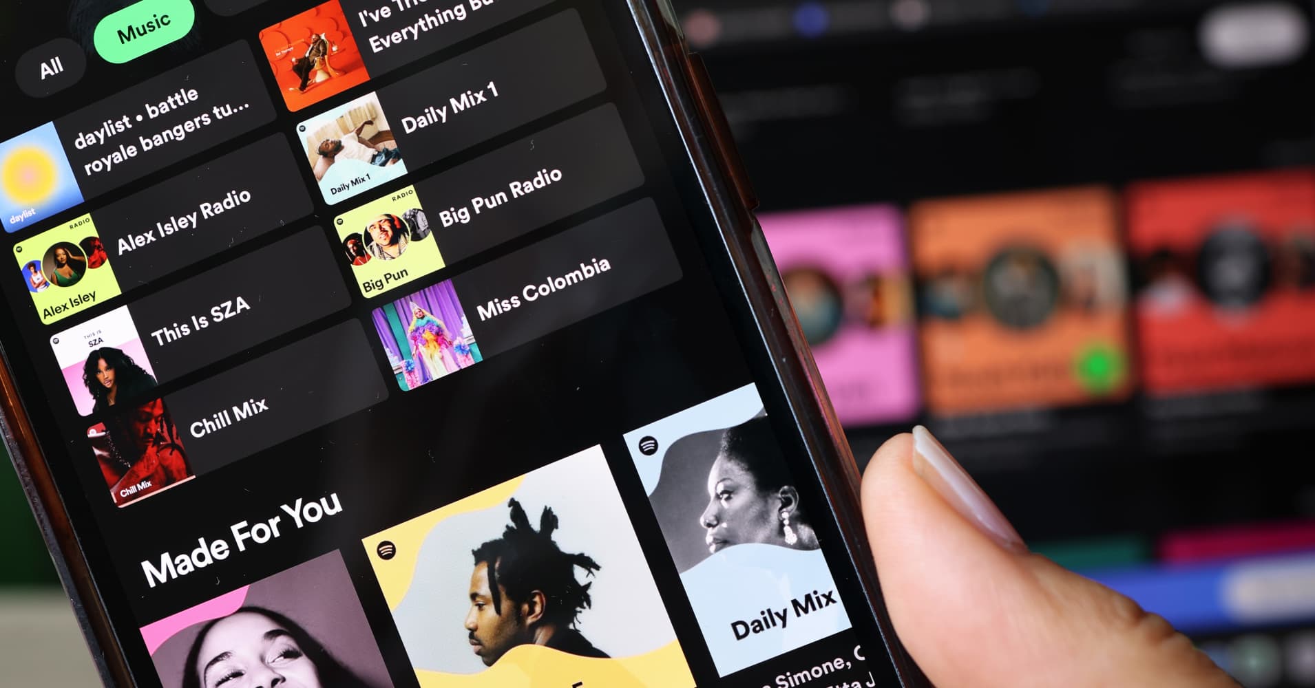 Spotify says it paid nearly 1,500 artists $1 million or more in ...