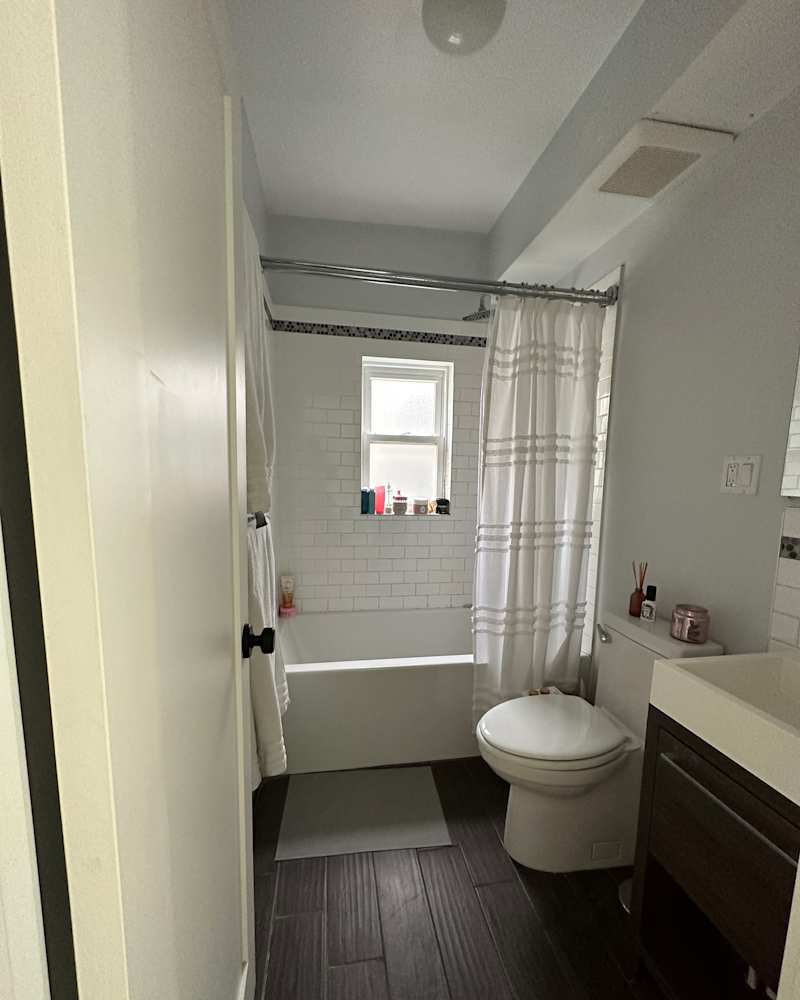 A 1908 Home's Bathroom Gut Reno Adds Vintage Charm Back In
