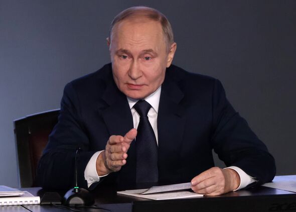 Putin dons military uniform and threatens to treat Ukrainian troops ...