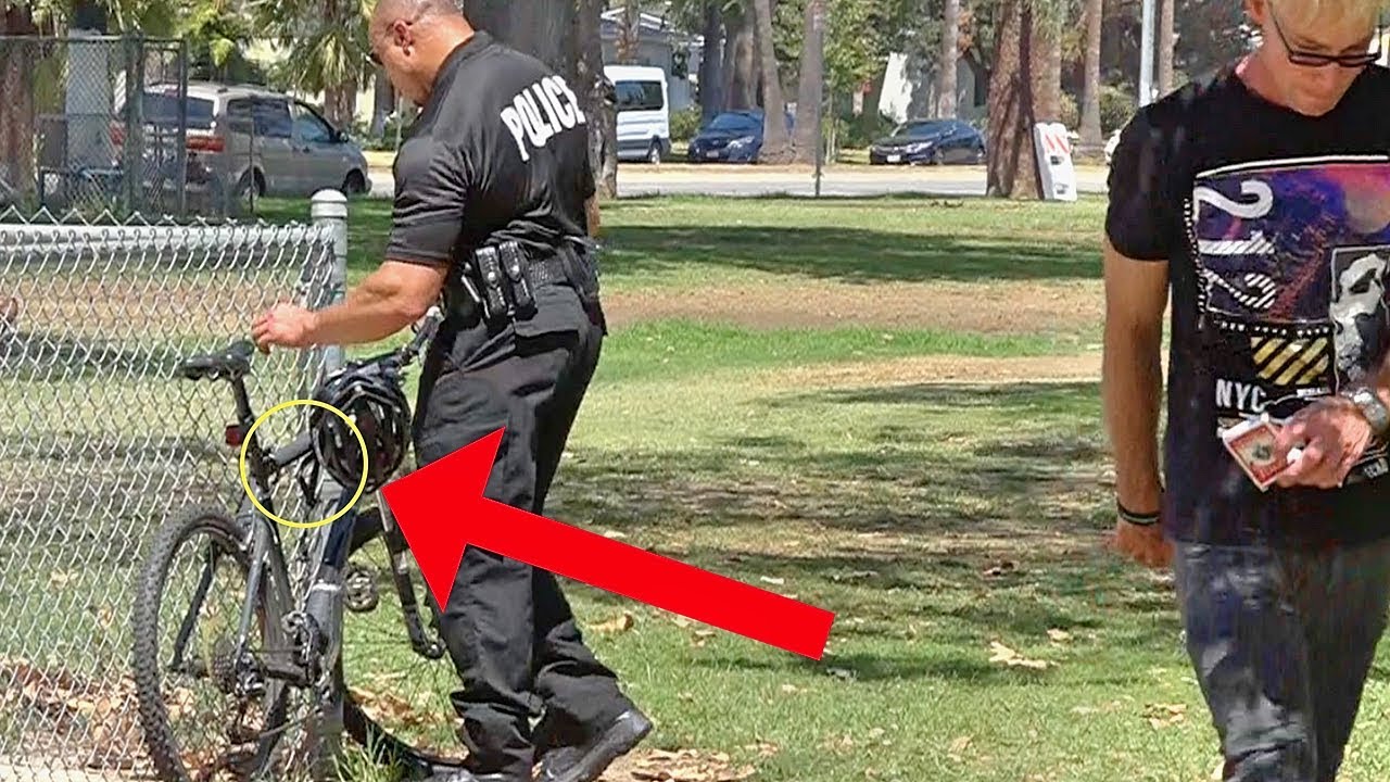 Handcuffing cop's bike to a fence