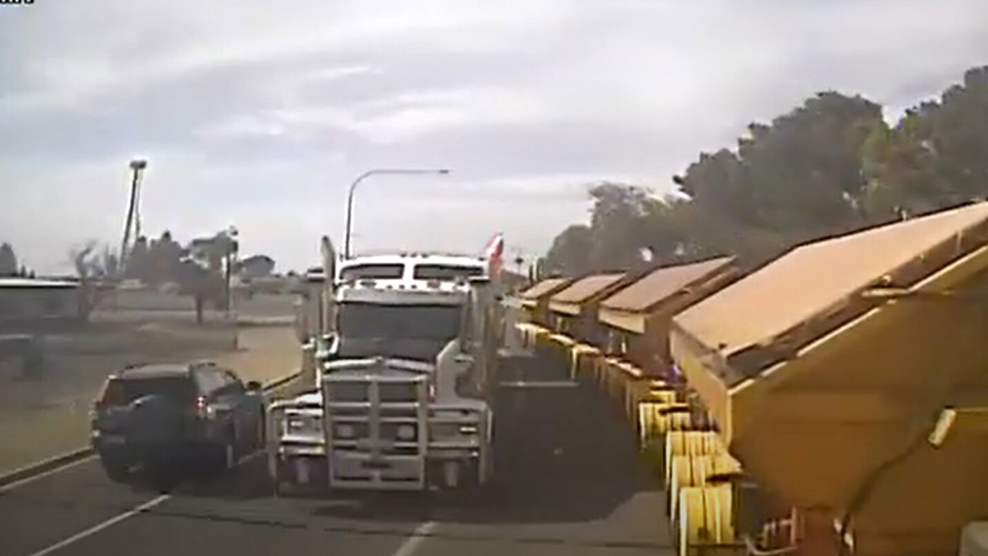 Truck driver to face court after dash cam captures road train almost ... Truck driver to face court after dash cam captures road train almost ...