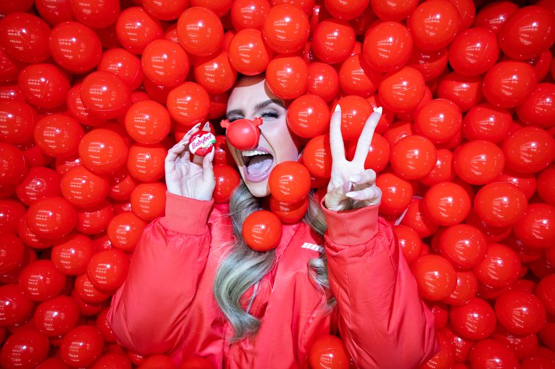 Massive red ball pit encourages adults to rediscover fun with a twist