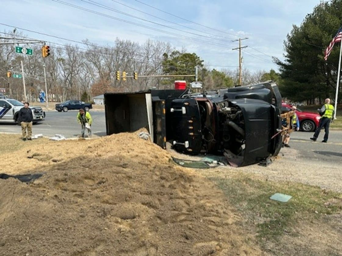 Dump Truck Overturns On As Driver Takes Turn Too Fast: Manchester PD