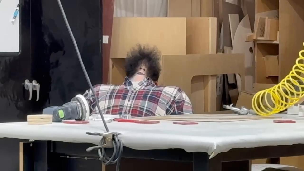 Man Draws Face Beneath Beard