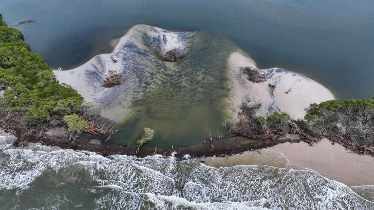 Authorities inspect battered tip of Bribie Island after Cyclone Alfred ...