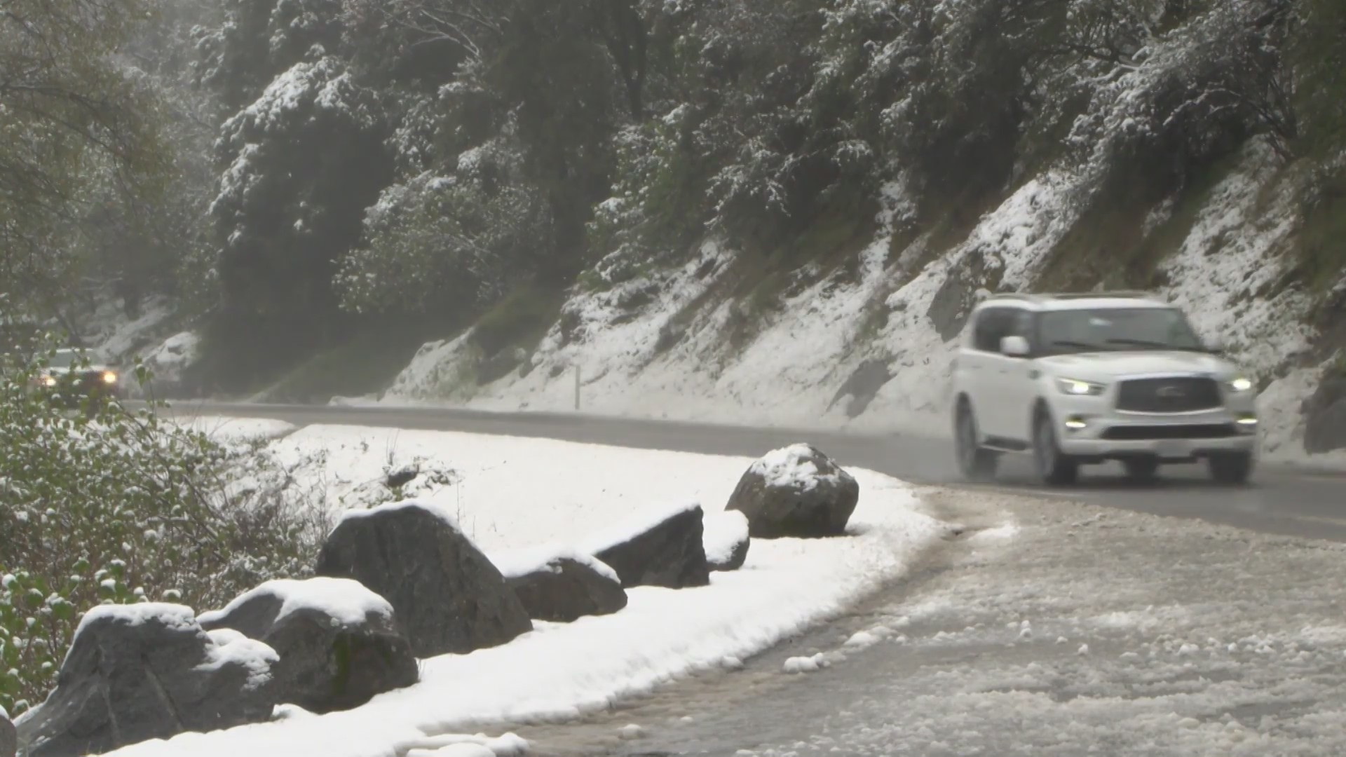 Oakhurst residents and visitors react to snow and rain