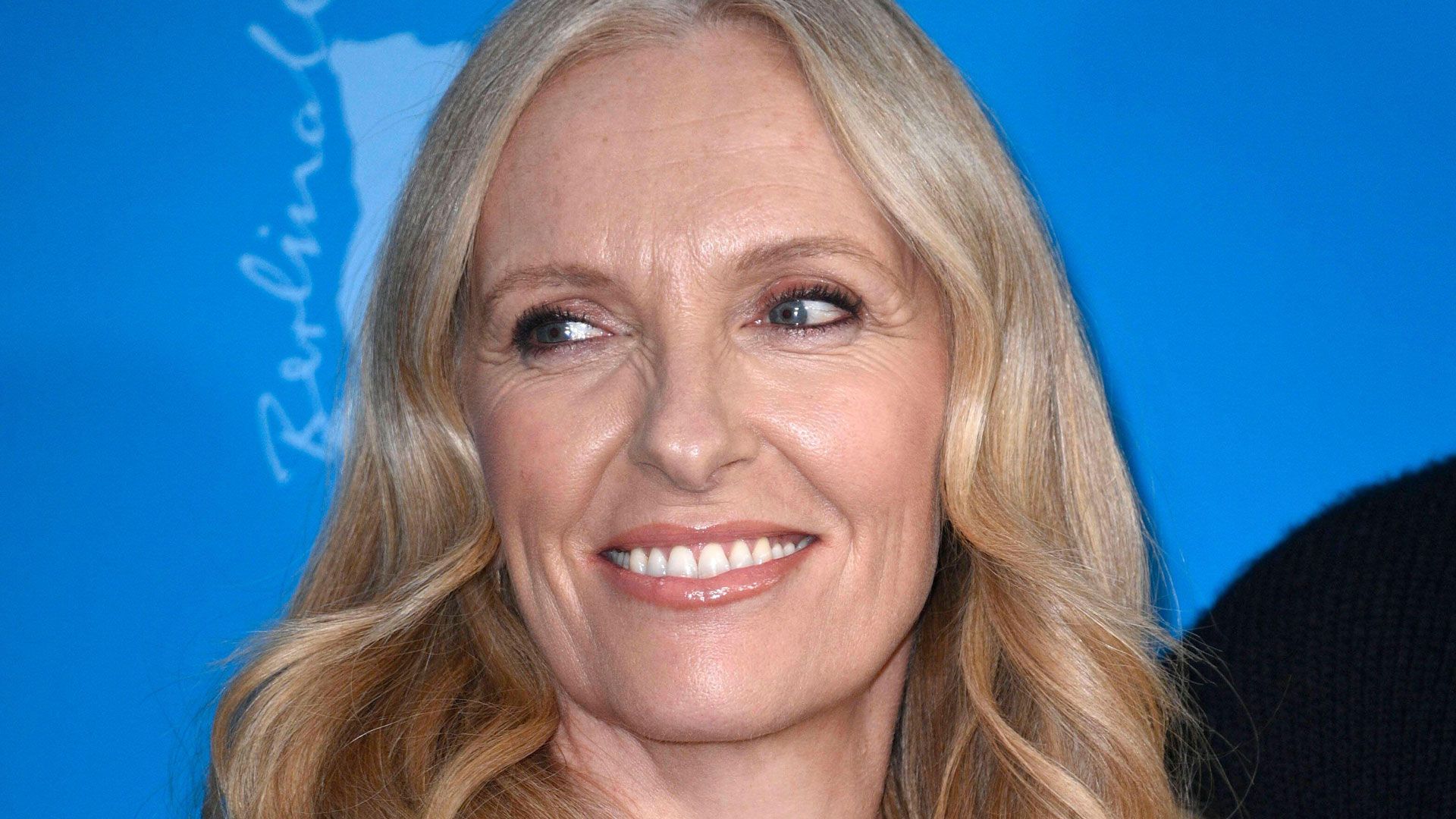 Toni Collette's impeccable style proved a white maxi dress with black ...