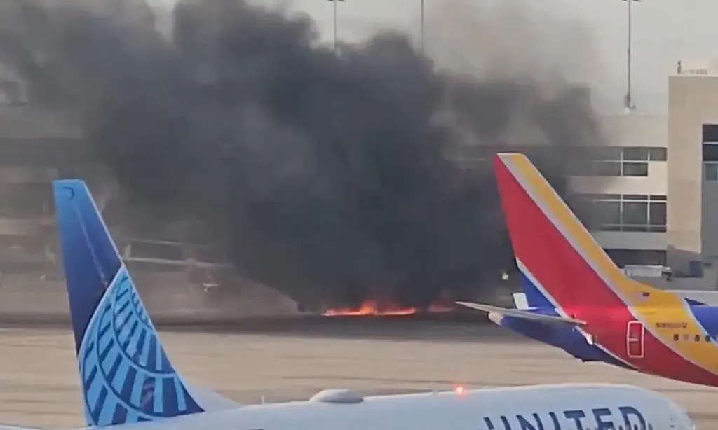 American Airlines jet engine catches fire after landing in Denver