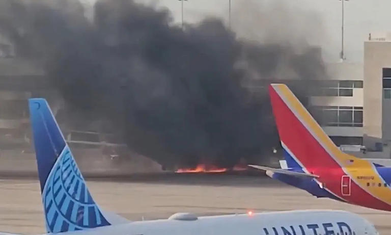 American Airlines jet engine catches fire after landing in Denver