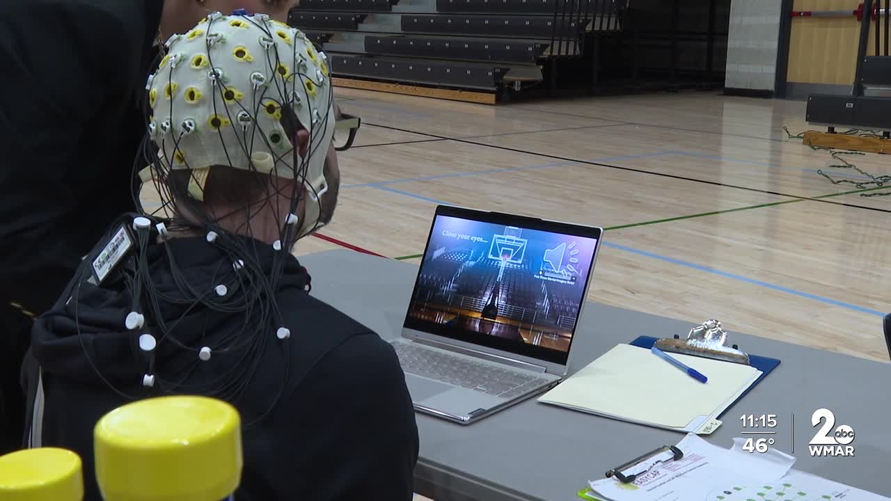 Researcher studying the science behind the perfect shot