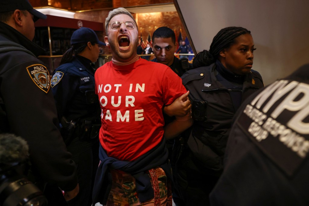 Almost 100 protesters arrested after storming Trump Tower chanting ...