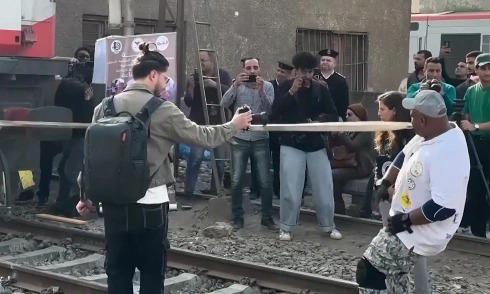 Egyptian wrestler pulls train with his teeth, sets 3 world records