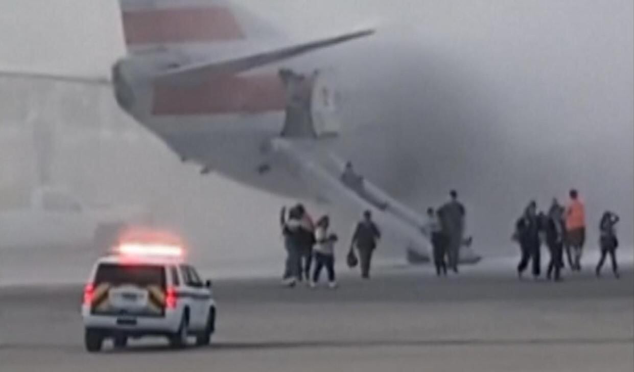 175 passengers evacuated as American Airlines plane catches fire