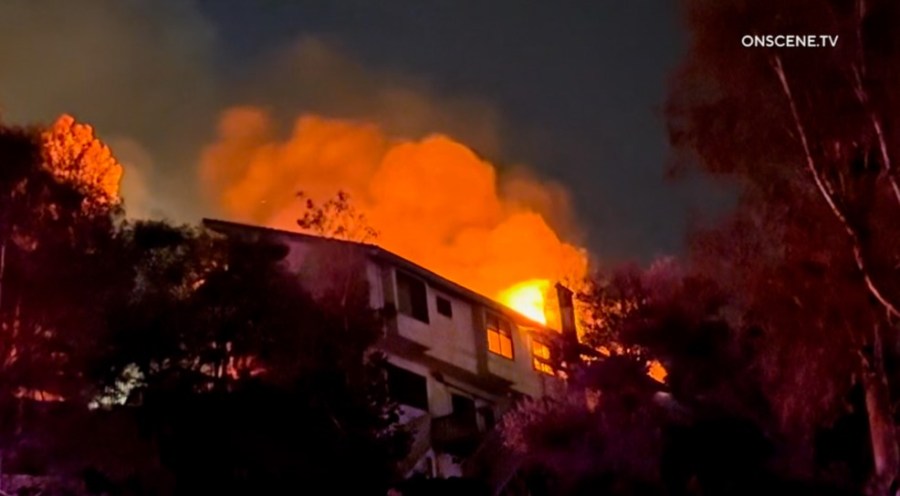 Crews battle three-story building fire in North County