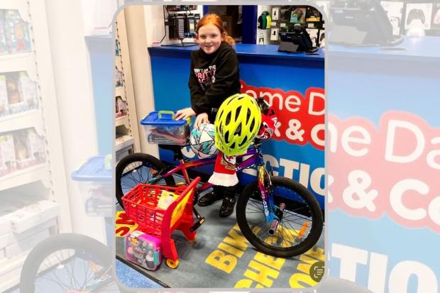 Charities and toy store join forces to replace Wrexham girl's stolen bike