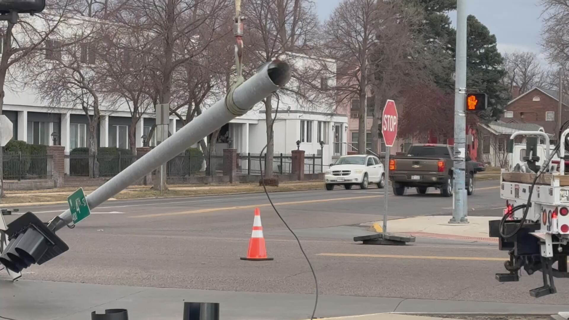 Wind gusts knock down light pole at West Fourth Street and North Willow