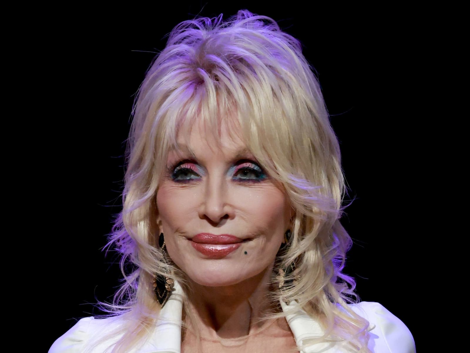 Dolly Parton, 79, supported by fans as she makes surprise first appearance after death of ...